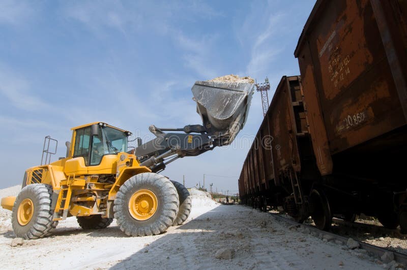Loader Loads the Wagon Train Stock Photo - Image of color, machine ...