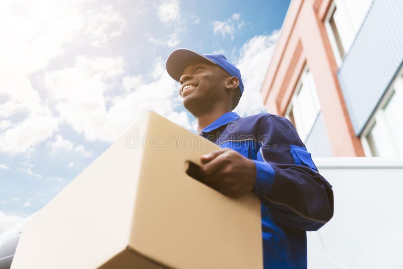 Loader Man with Cardboard Box Stock Photo - Image of delivery ...