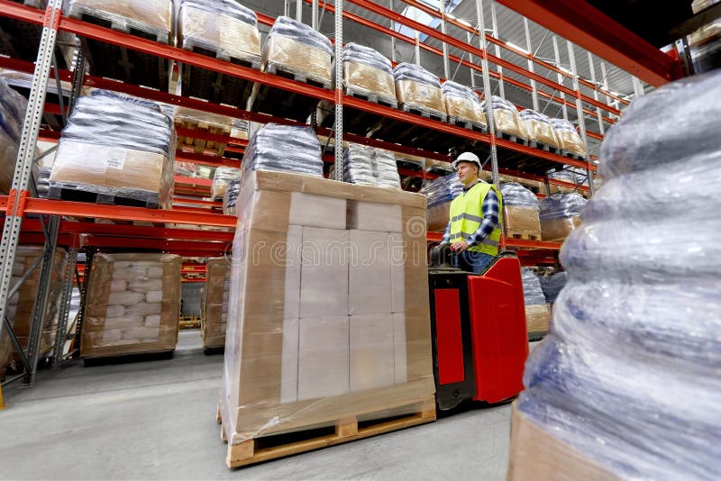 Man Operating Forklift Loader at Warehouse Stock Photo - Image of ...