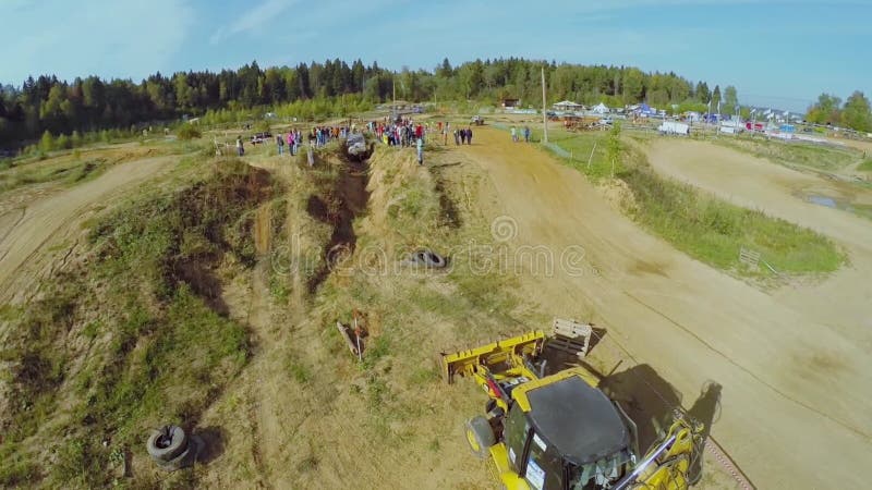 Loader Pulls Off-road Vehicle from Ditch Obstacle Stock Footage - Video ...