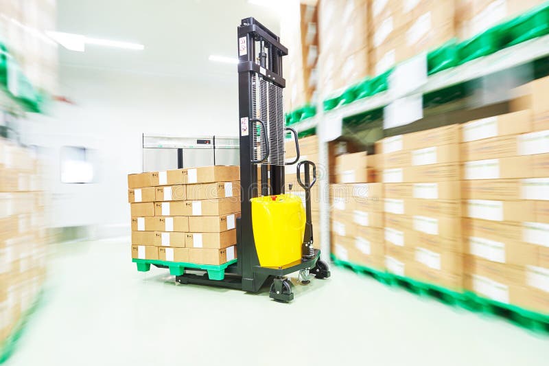 Warehouse stacker at work stock photo. Image of operator - 19304648