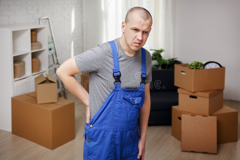 Loader Suffering from Back Pain at Home Stock Photo - Image of house ...
