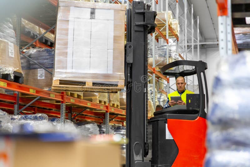 Loader with Tablet Pc on Forklift at Warehouse Stock Photo - Image of ...