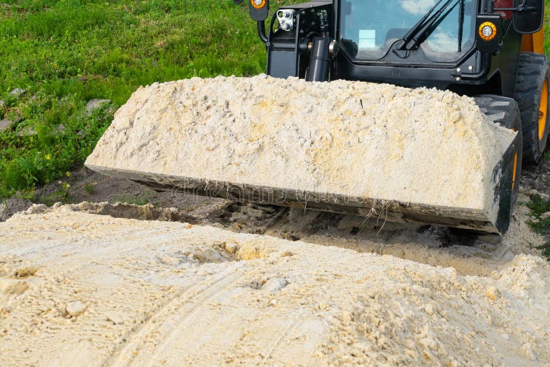 The Loader Took the Sand into the Bucket for Construction Work. Stock ...