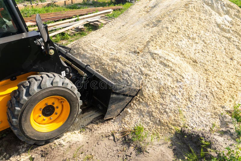 The Loader Took the Sand into the Bucket for Construction Work. Stock ...