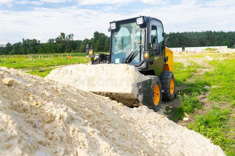 The Loader Took the Sand into the Bucket for Construction Work. Stock ...