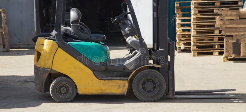 The Loader is in the Warehouse. Loading of Goods in the Warehouse Stock ...