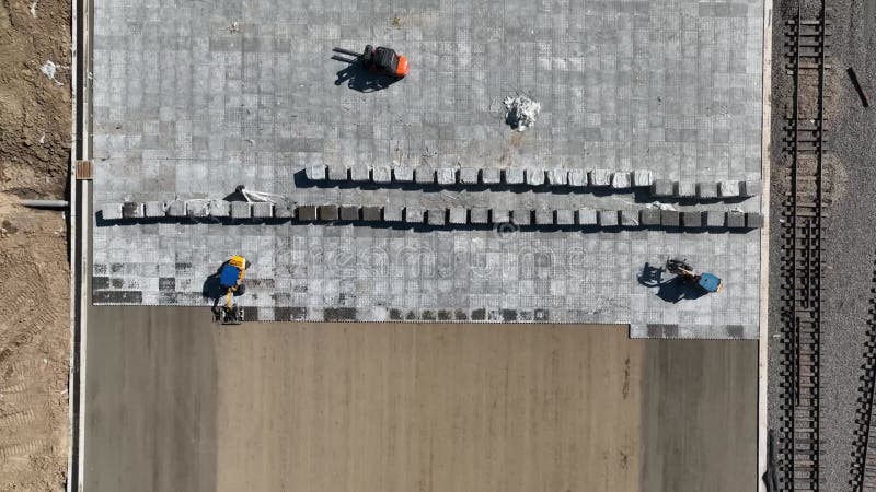 Loaders Lay Paving Slabs. View from a Drone. Stock Video - Video of ...