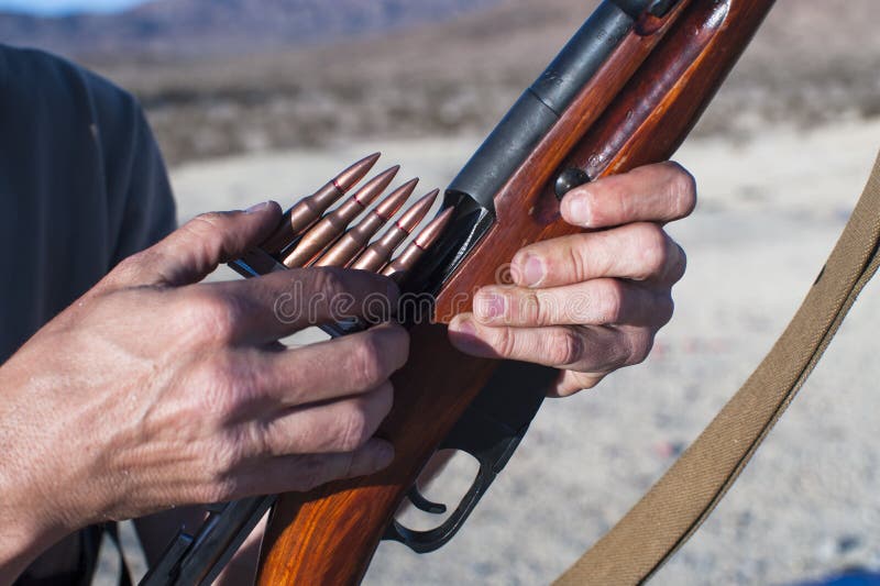 Loading Ammunition into Rifle Stock Photo - Image of guns, control ...
