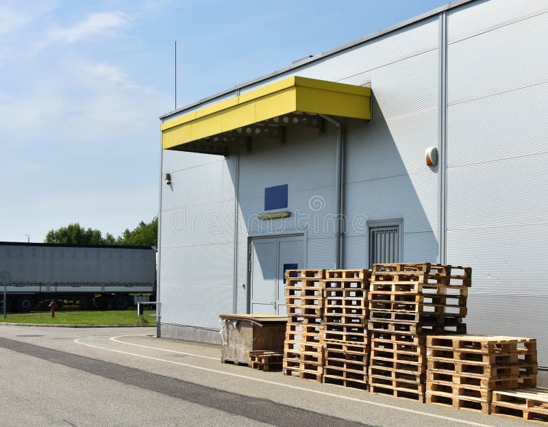 Loading Area of a Warehouse Building Stock Photo - Image of park, blue ...