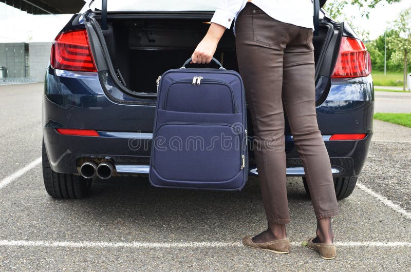 Loading a Bag into the Trunk Stock Image - Image of young, luxury: 37379987