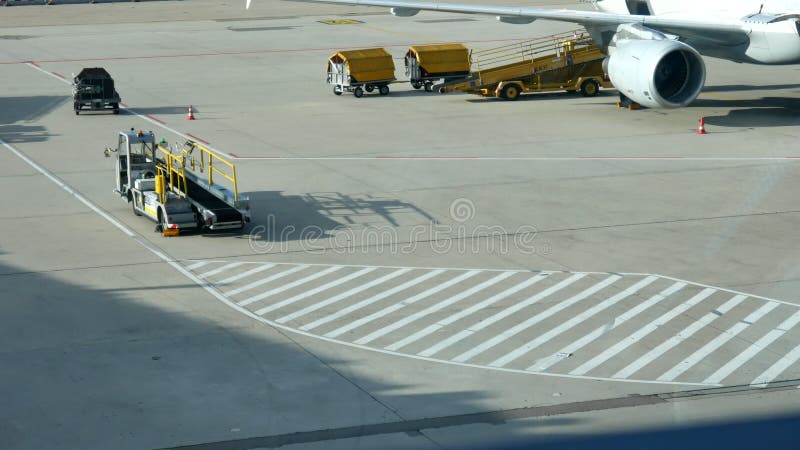 Loading Baggage of Passengers on a Plane at the Airport Stock Footage ...