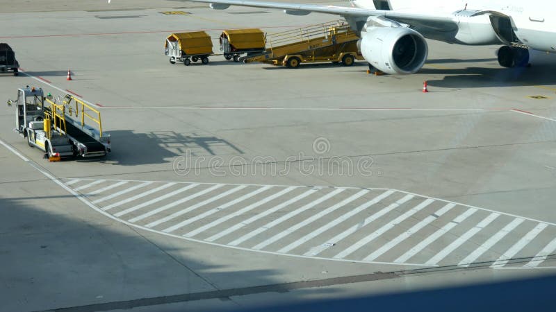 Loading Baggage of Passengers on a Plane at the Airport Stock Footage ...
