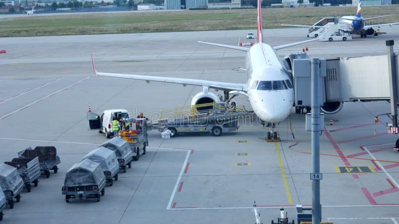 Loading Baggage of Passengers on a Plane at the Airport Stock Video ...