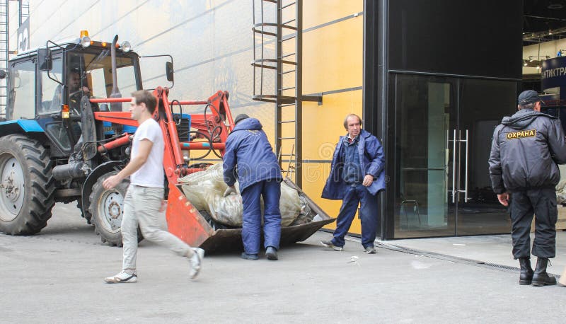 Loading bags of garbage. editorial stock image. Image of person - 80072739