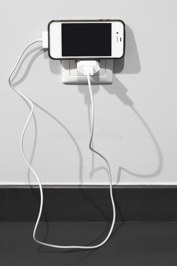 Loading Batteries in a Smartphone with Socket and Wall Stock Photo ...