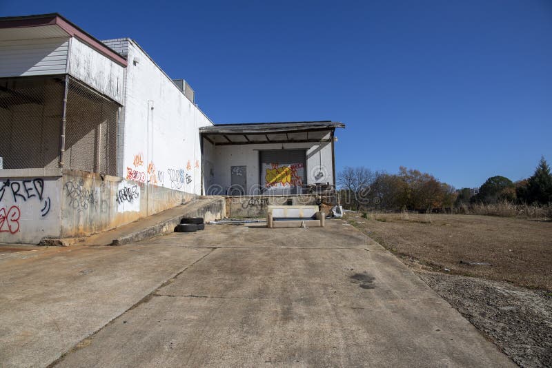 A Loading Bay on the Side of an Abandoned Building Covered with ...