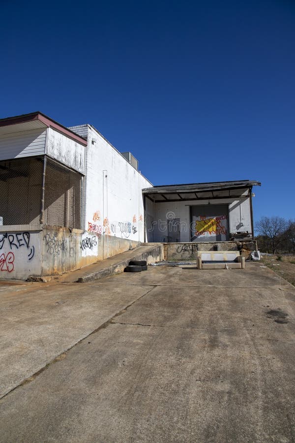A Loading Bay on the Side of an Abandoned Building Covered with ...