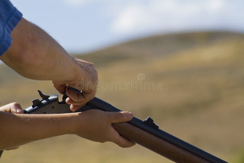 Loading black powder rifle stock photo. Image of position - 11065644