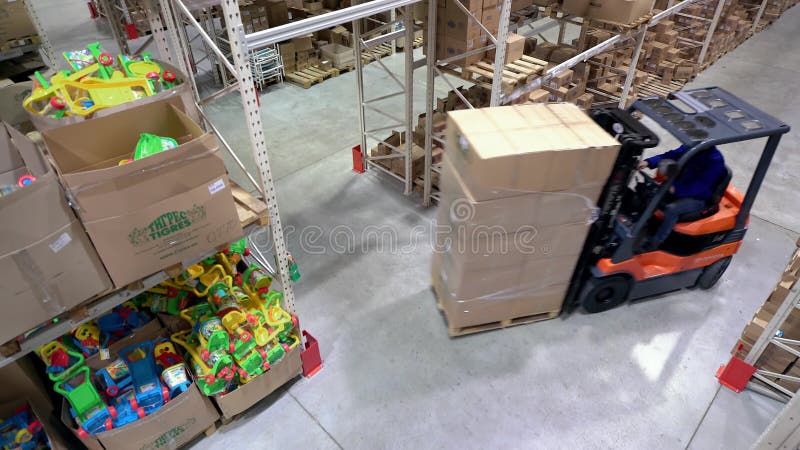 Forklift Rides on in Logistic Warehouse with Pallet. Logistic Warehouse ...