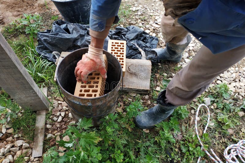 Loading Bricks into a Bucket and Climbing To the Top by Hand, Building ...