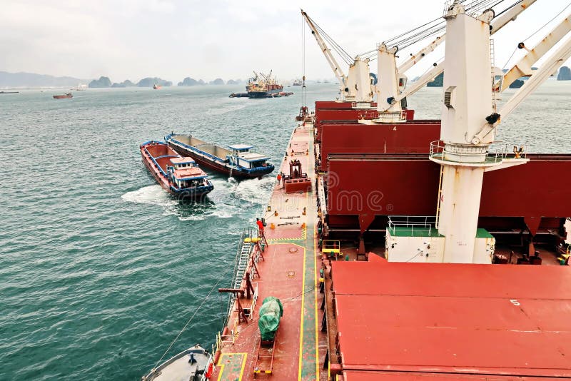Loading Bulk Cargo of Limestone from Barges into a Bulk Carrier by ...