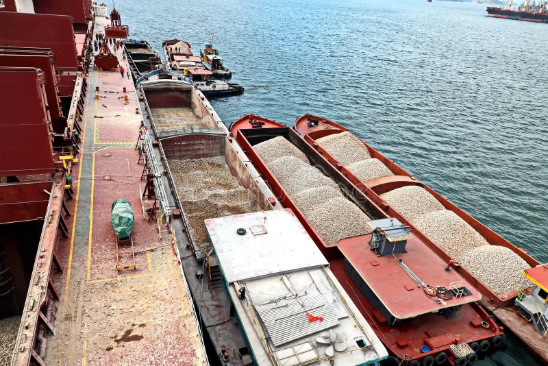Loading Bulk Cargo of Limestone from Barges into a Bulk Carrier by ...