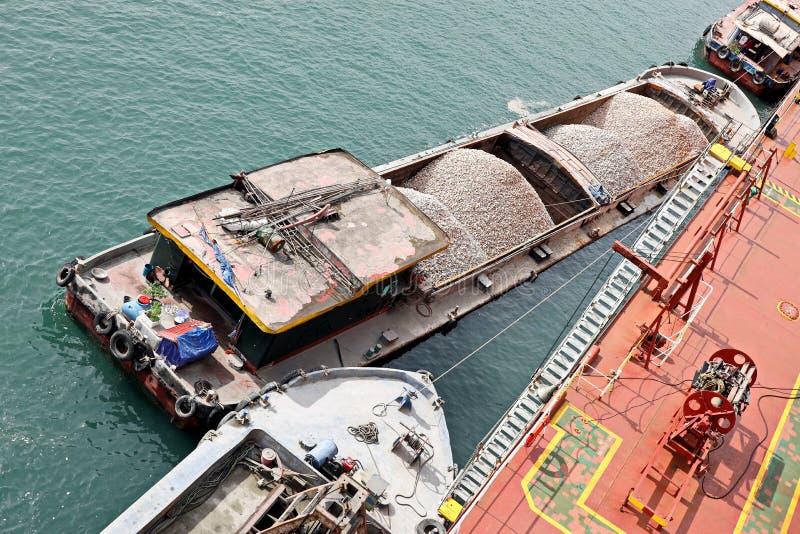 Loading Bulk Cargo of Limestone from Barges into a Bulk Carrier by ...