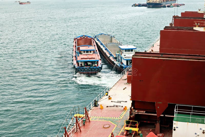 Loading Bulk Cargo of Limestone from Barges into a Bulk Carrier by ...