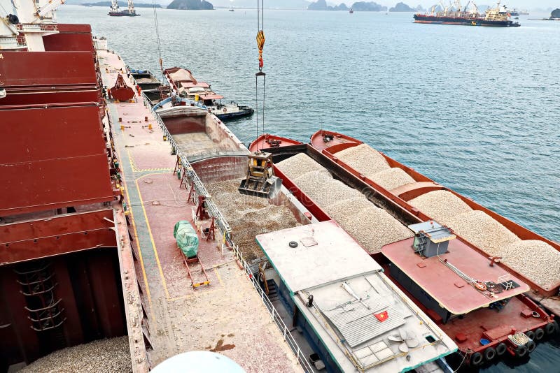 Loading Bulk Cargo of Limestone from Barges into a Bulk Carrier by ...