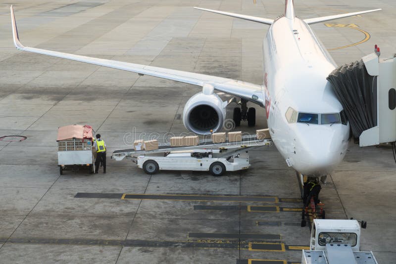 Loading Cargo on the Plane in Airport. Cargo Airplane Loading or ...