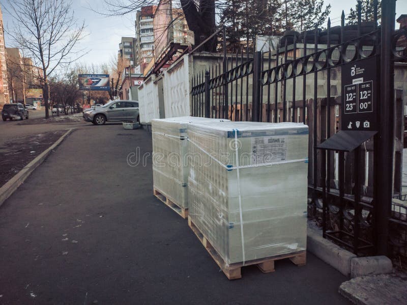 Loading Cargo from the Street into a Building in Winter. Editorial ...