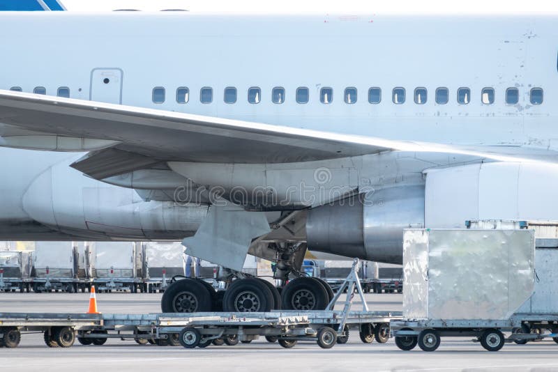 Loading cargo to plane stock photo. Image of service - 168532950