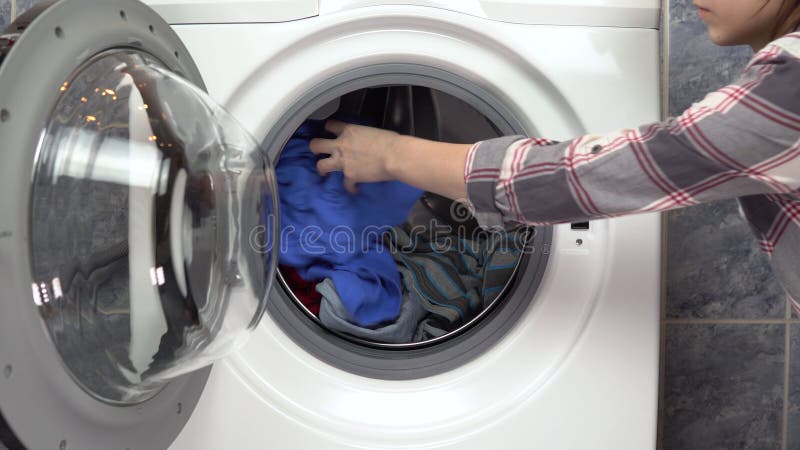 Loading Clothes into the Washing Machine Stock Image - Image of ...