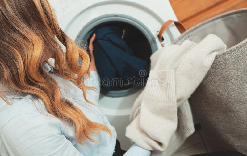 Loading Clothes into Washing Machine Stock Photo - Image of clean, girl ...