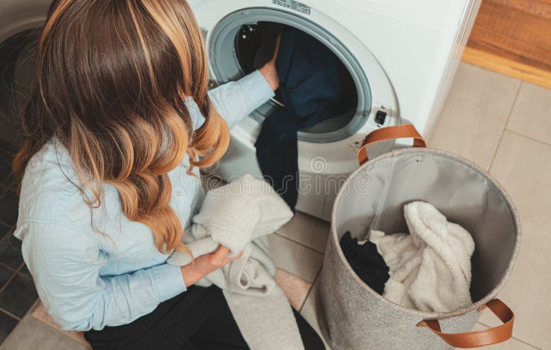 Loading Clothes into Washing Machine Stock Photo - Image of domestic ...