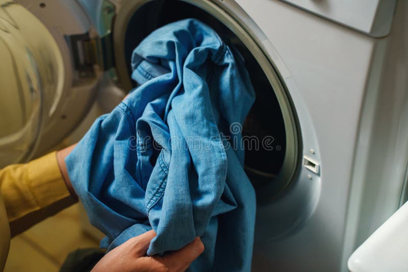 Loading Clothes into Washing Machine Stock Photo - Image of human ...
