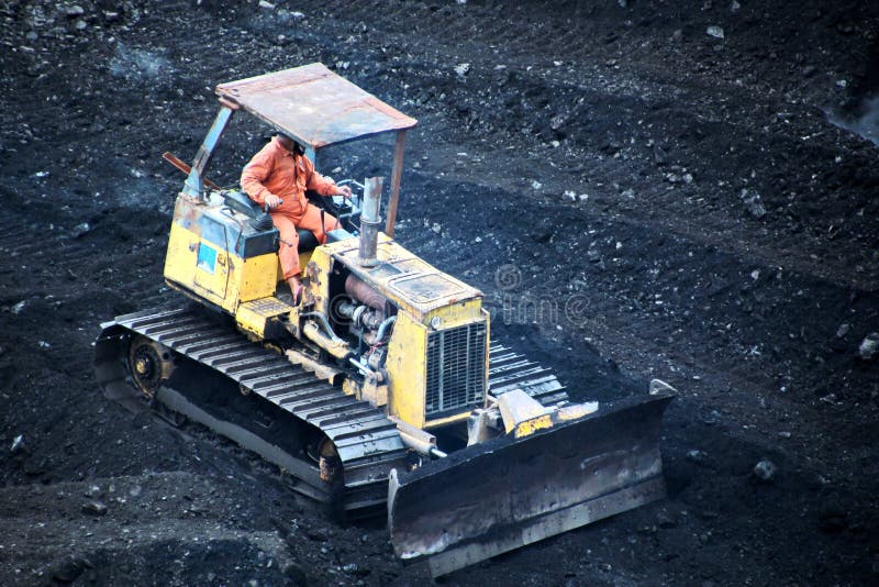 Loading Coal from Cargo Barges Onto a Bulk Carrier Using Ship Cranes ...