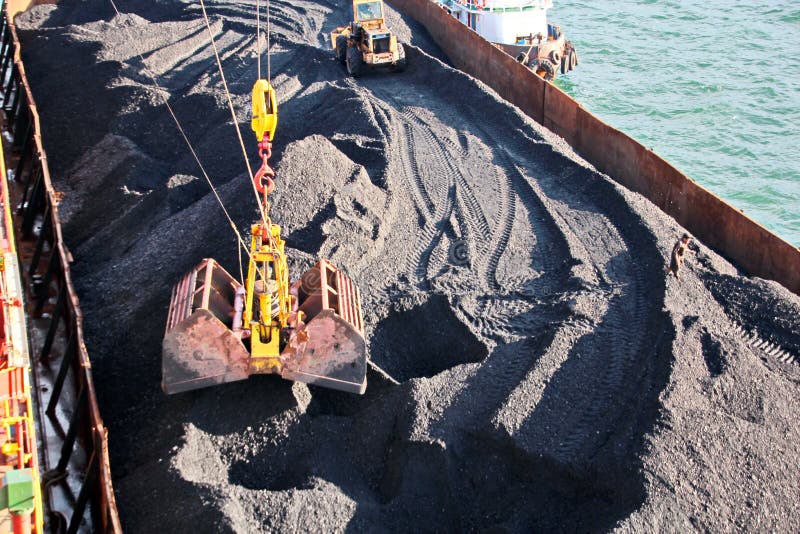 Loading Coal from Cargo Barges Onto a Bulk Carrier Using Ship Cranes ...