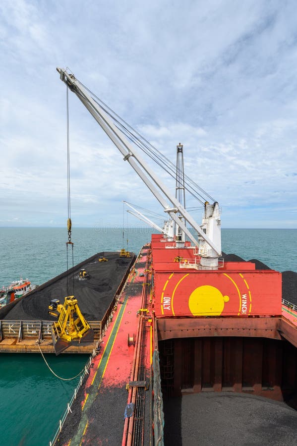Loading Coal from Cargo Barges Onto a Bulk Vessel Using Ship Cranes ...