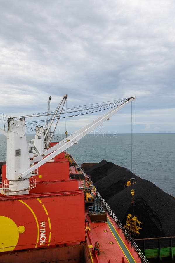 Loading Coal from Cargo Barges Onto a Bulk Vessel Using Ship Cranes ...