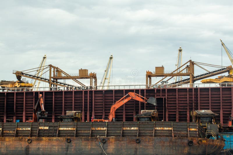 Loading Coal from Cargo Barges Onto a Bulk Vessel Using Ship Cranes ... Loading Coal from Cargo Barges Onto a Bulk Vessel Using Ship Cranes ...