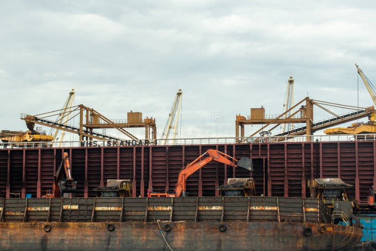 Loading Coal from Cargo Barges Onto a Bulk Vessel Using Ship Cranes ...