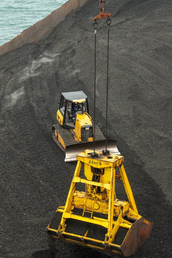 Loading Coal from Cargo Barges Onto a Bulk Vessel Using Ship Cranes ... Loading Coal from Cargo Barges Onto a Bulk Vessel Using Ship Cranes ...