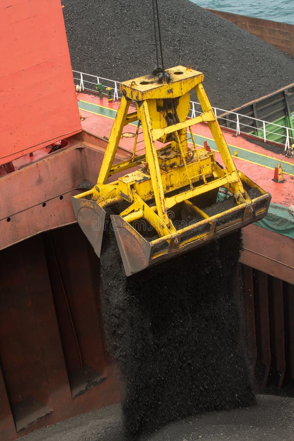 Loading Coal from Cargo Barges Onto a Bulk Vessel Using Ship Cranes in ...