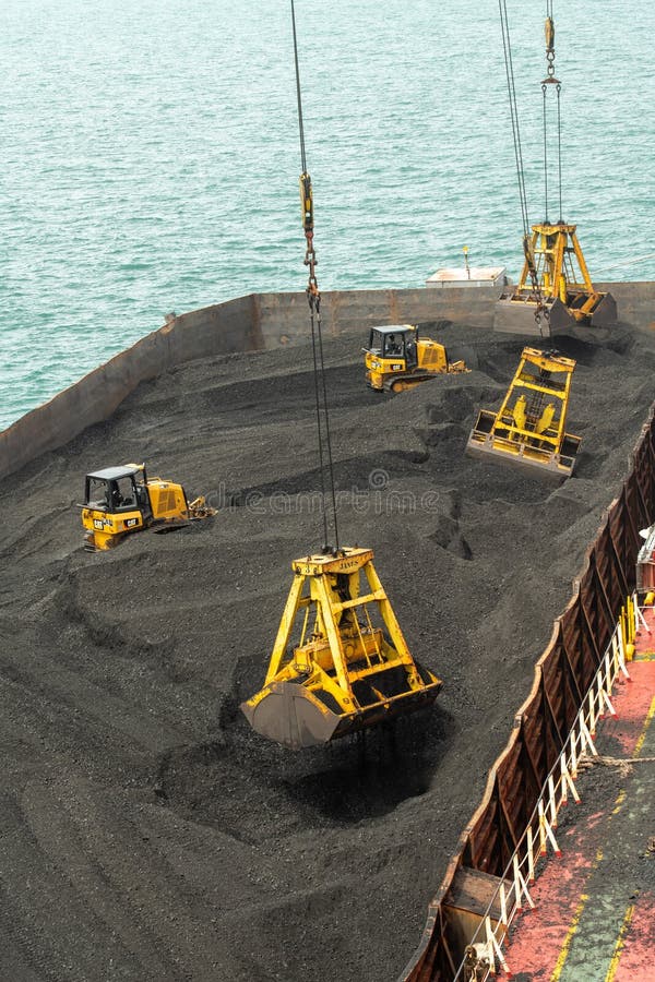 Loading Coal from Cargo Barges Onto a Bulk Vessel Using Ship Cranes ...