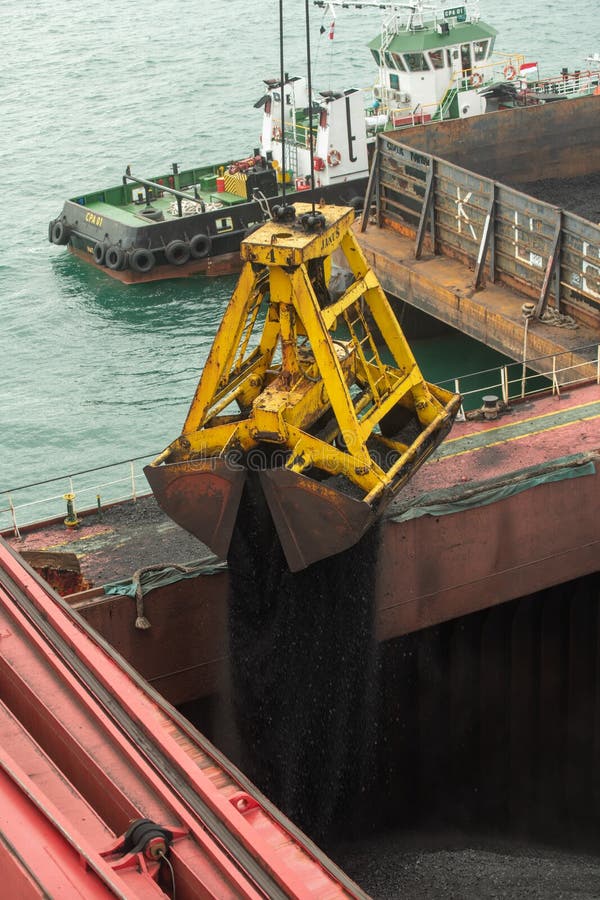 Loading Coal from Cargo Barges Onto a Bulk Vessel Using Ship Cranes in ...