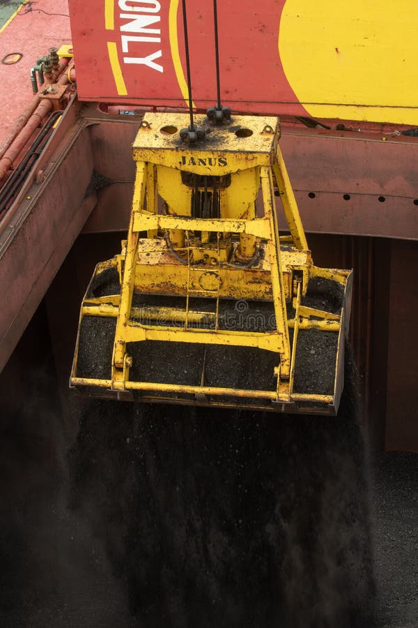 Loading Coal from Cargo Barges Onto a Bulk Vessel Using Ship Cranes in ...