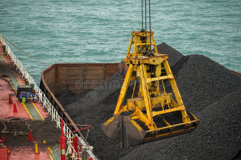 Loading Coal from Cargo Barges Onto a Bulk Vessel Using Ship Cranes in ...