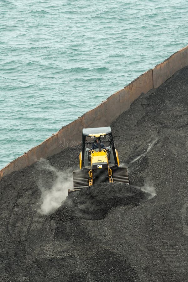 Loading Coal from Cargo Barges Onto a Bulk Vessel Using Ship Cranes ... Loading Coal from Cargo Barges Onto a Bulk Vessel Using Ship Cranes ...